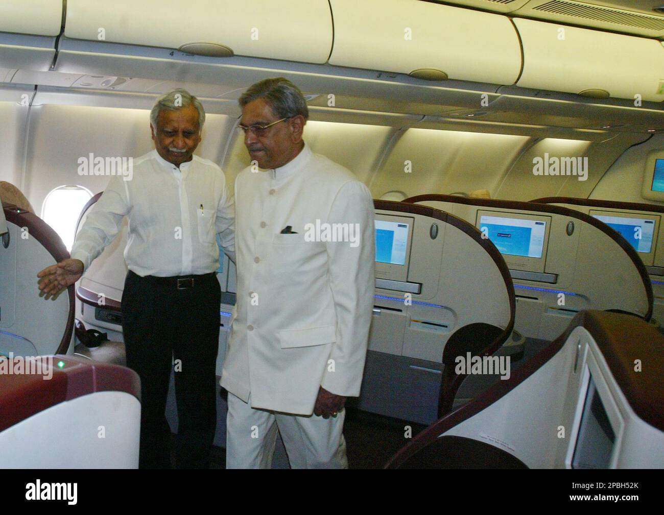 Chairman, Jet Airways, Naresh Goel, left, shows his newly acquired ...