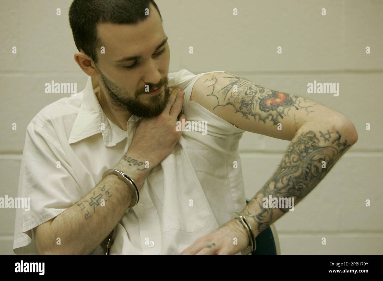 Inmate Michael Tisius, sentenced to death in the killing of two jail officers, displays his ...