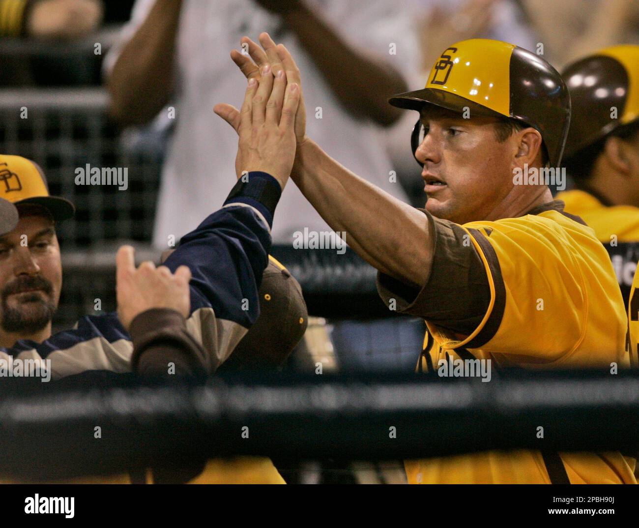 San Diego Padres' Brian Giles, right, is congratulated after scoring in ...