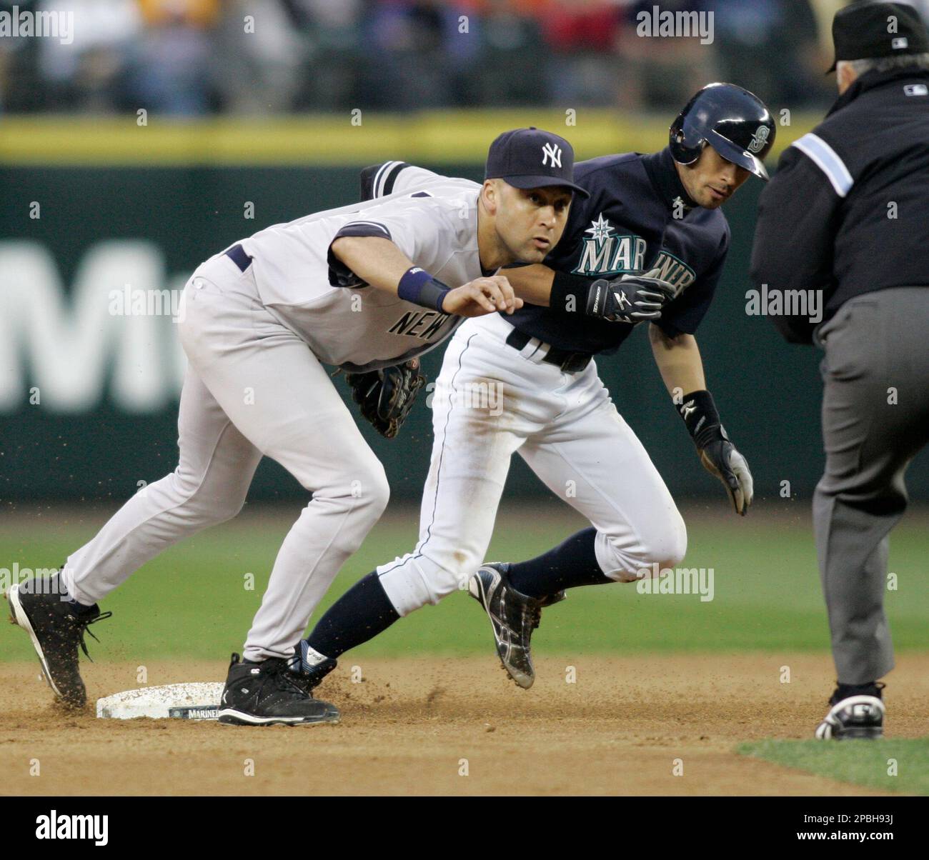 New York Yankees' shortstop Derek Jeter, left, looks up as Seattle ...
