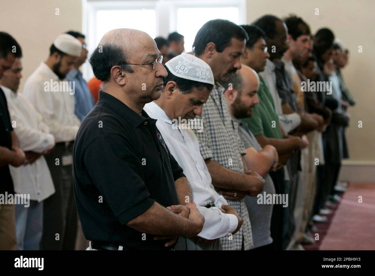 Muslim men are seen during a prayer service at the Islamic Center of ...