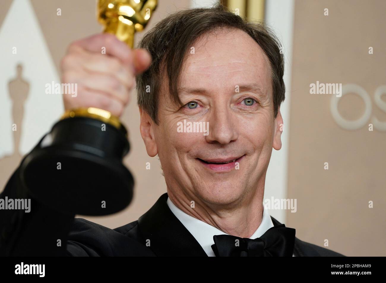 Volker Bertelmann poses with the award for best original score for "All ...