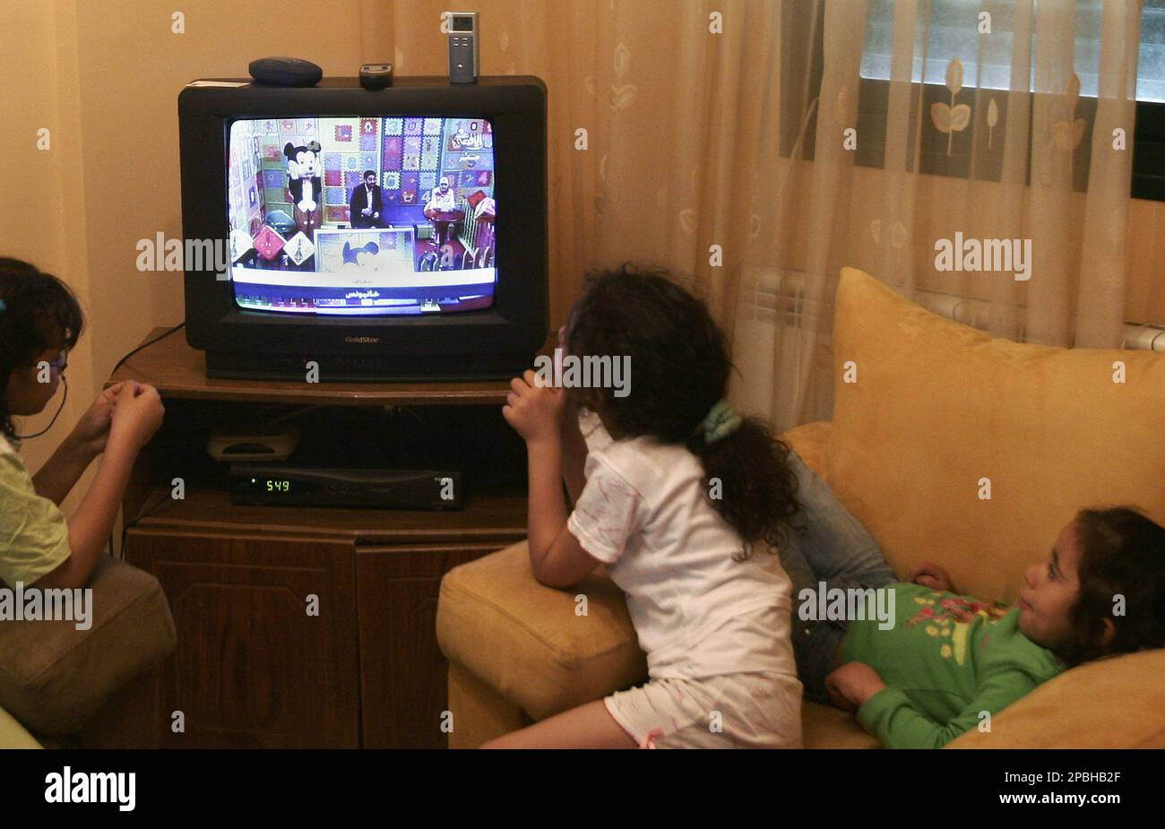 Palestinian children watch Al-Aqsa TV, a station run by Hamas, during a ...