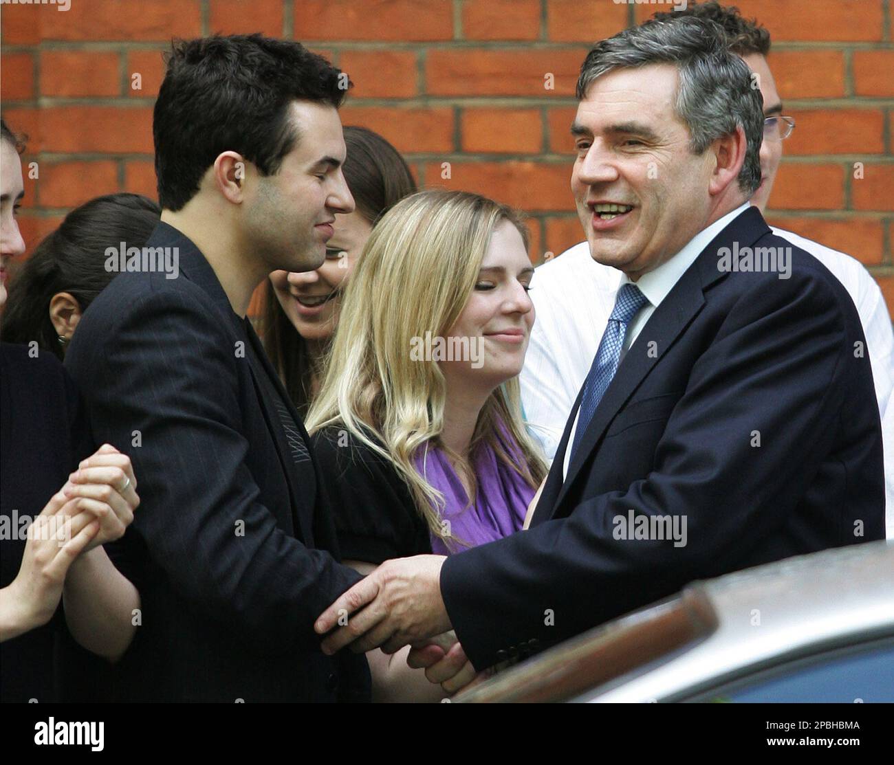 British Chancellor of the Exchequer Gordon Brown greets supporters, as ...