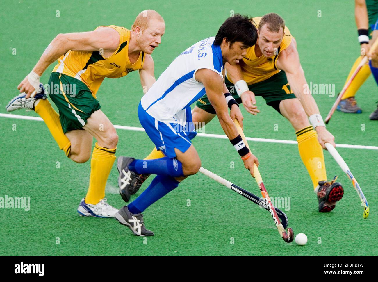 South Korea's You Hyo Sik, center, is challenged by Australia's Andrew ...