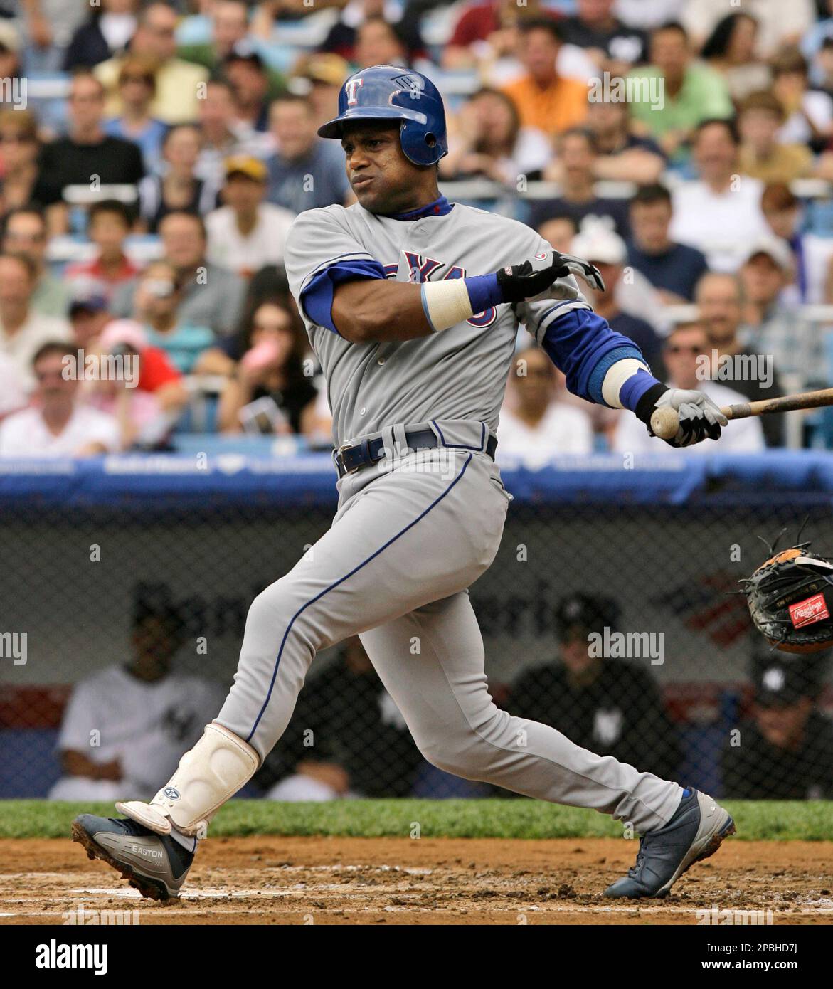 Texas Rangers' Sammy Sosa follows through on his first-inning RBI ...