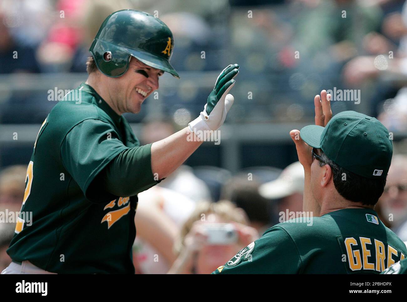 Oakland Athletics' Jack Cust, left, is congratulated by manager Bob ...