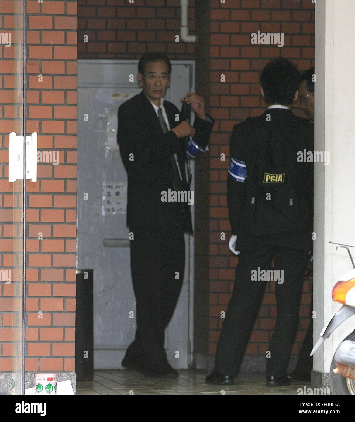 Members of Japan's Public Security Intelligence Agency are seen in the ...