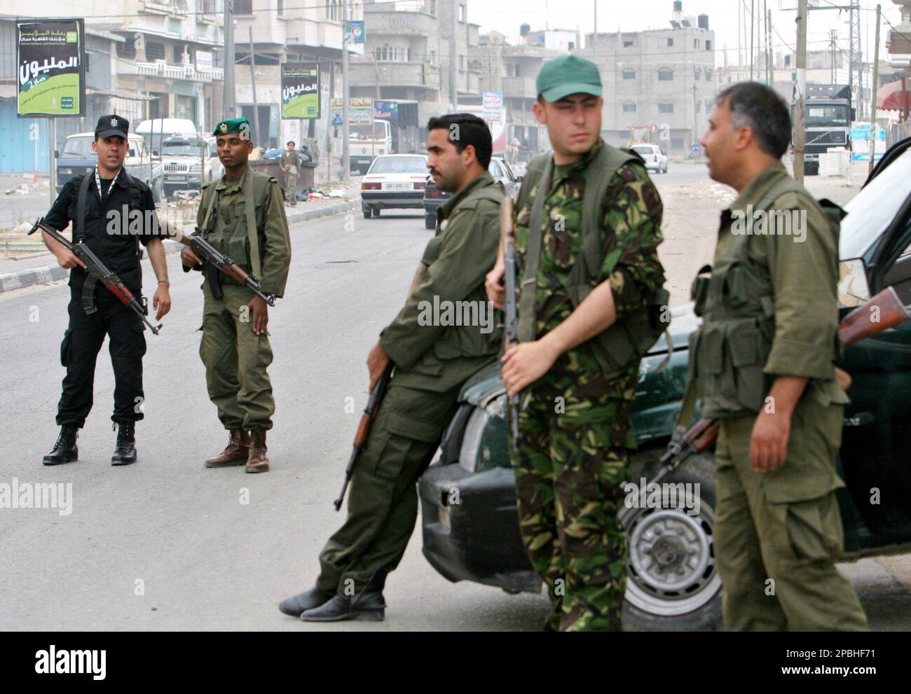 Members of Palestinian security forces man a temporary checkpoint in ...
