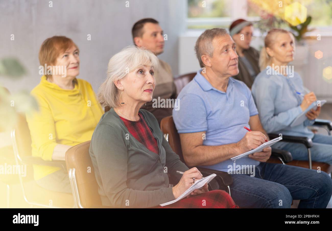 Elderly people study in classroom on refresher courses Stock Photo - Alamy