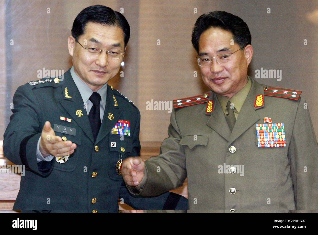 South Korean delegate Army Col. Moon Sung-mook, left, greets his North ...