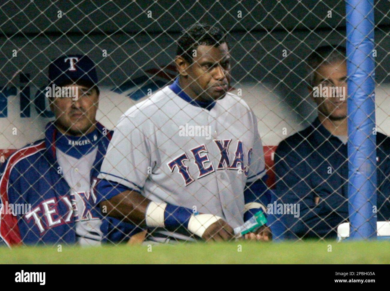 Texas Rangers' Sammy Sosa watches from the dugout during the fourth ...