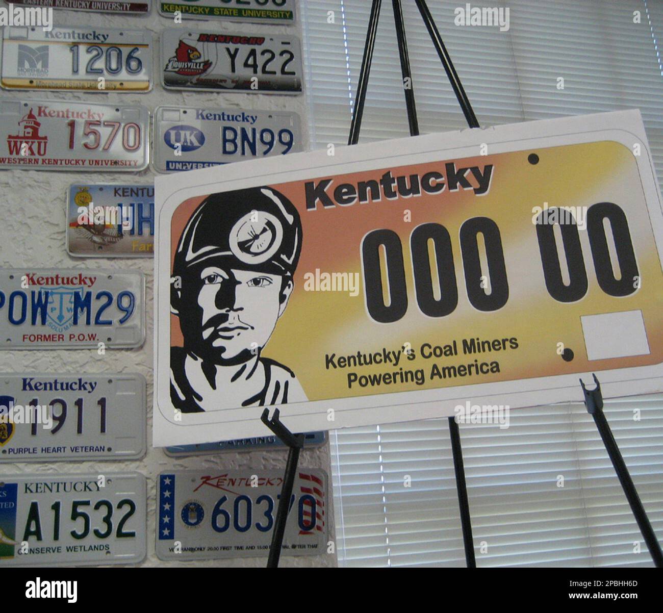 A large sample license plate displaying a coal miner is shown at the ...
