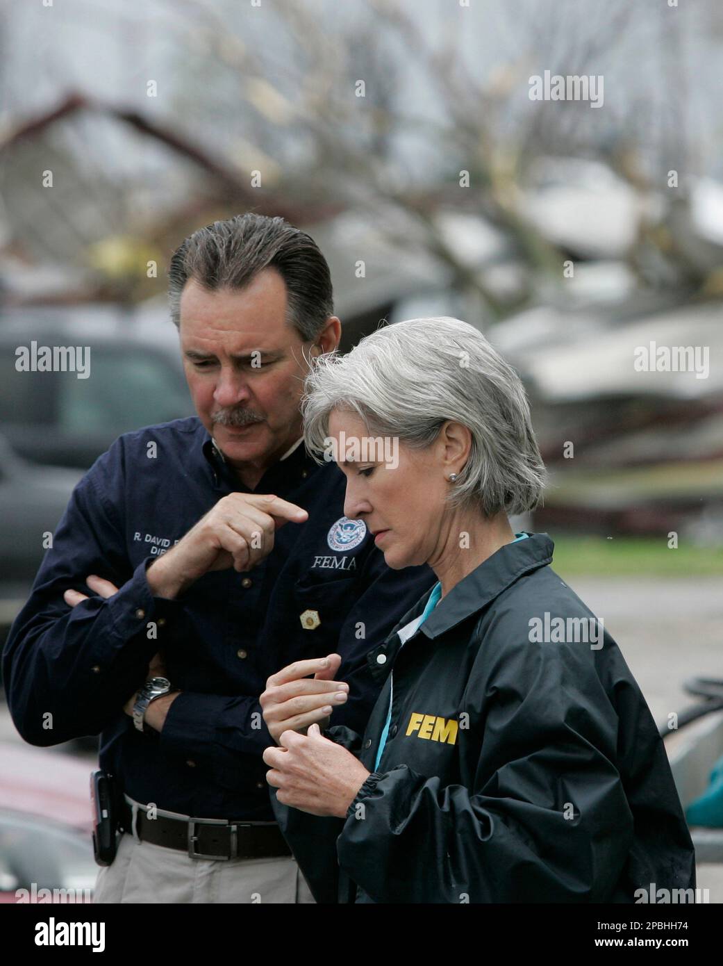 FEMA Director R. David Paulison, left, talks with Kansas Gov. Kathleen ...