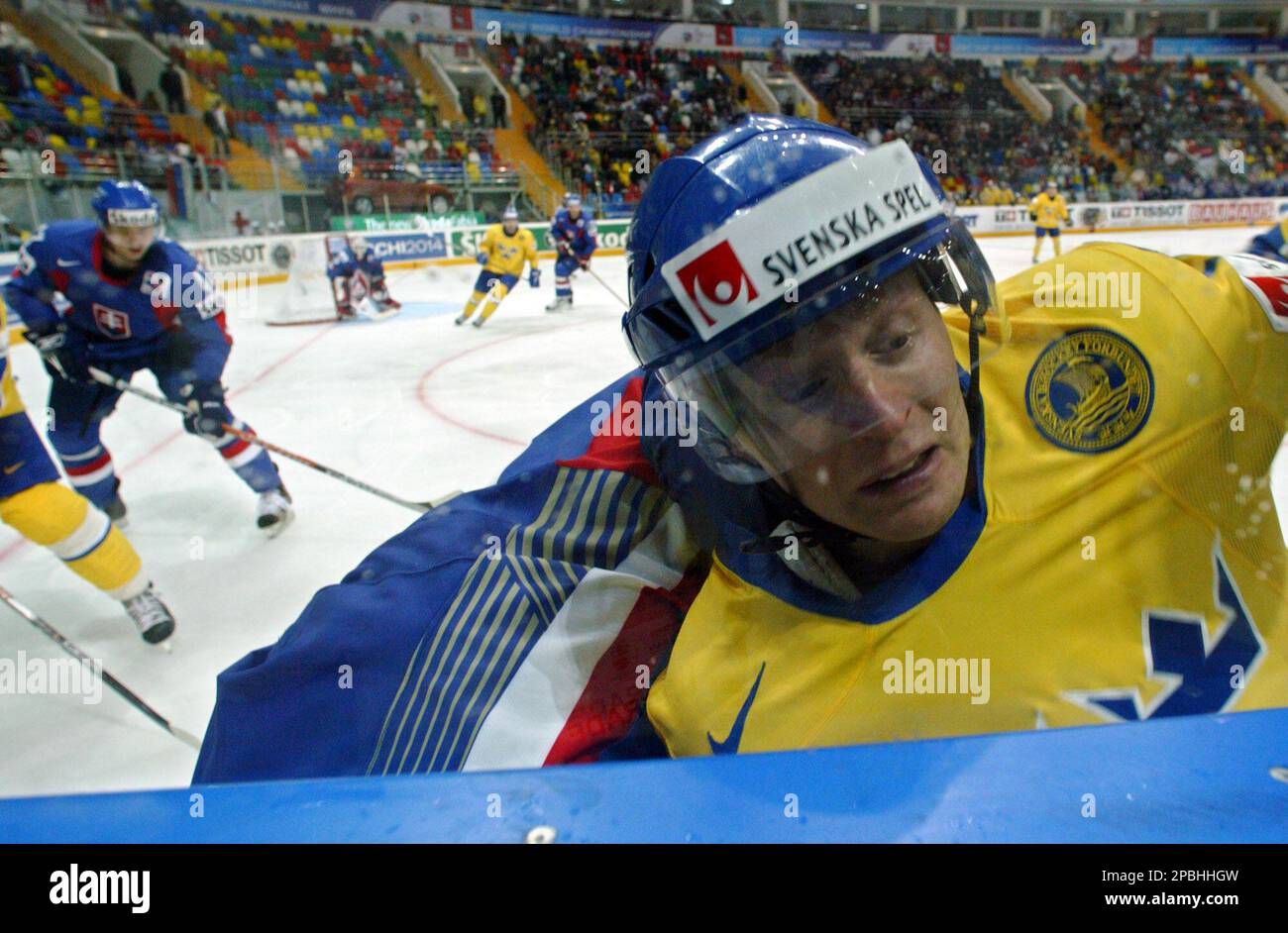 Sweden's Johan Davidsson, right, is boarded by Slovakian Richard ...