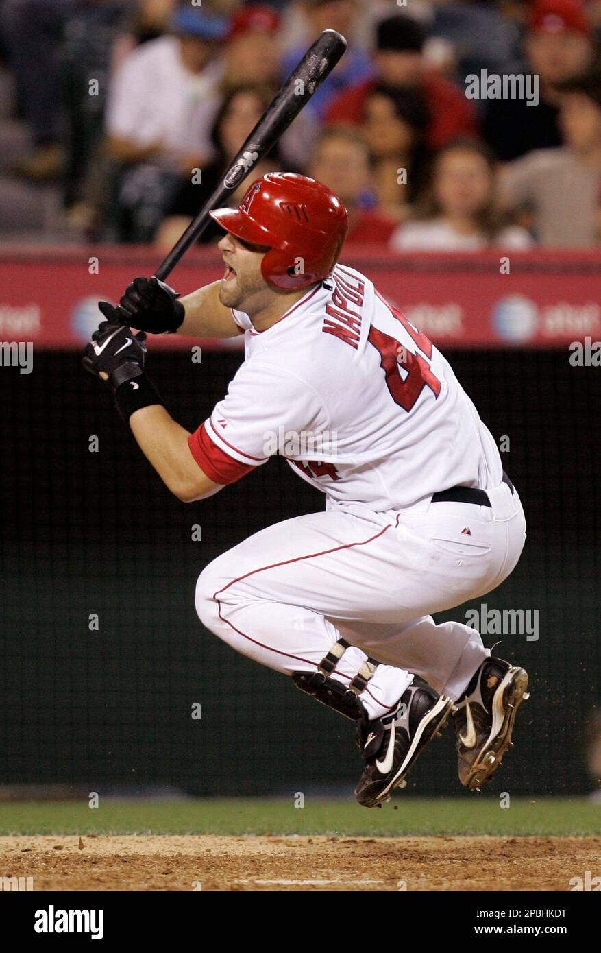 Los Angeles Angels' Mike Napoli winces in pain after getting hit by a ...