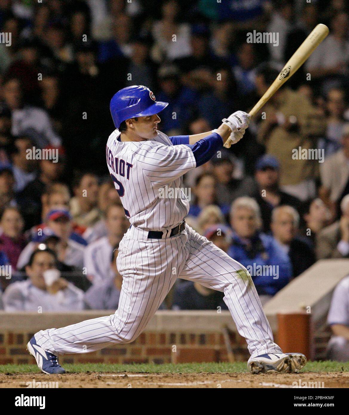 Chicago Cubs' Ryan Theriot hits an RBI single during the fifth inning ...