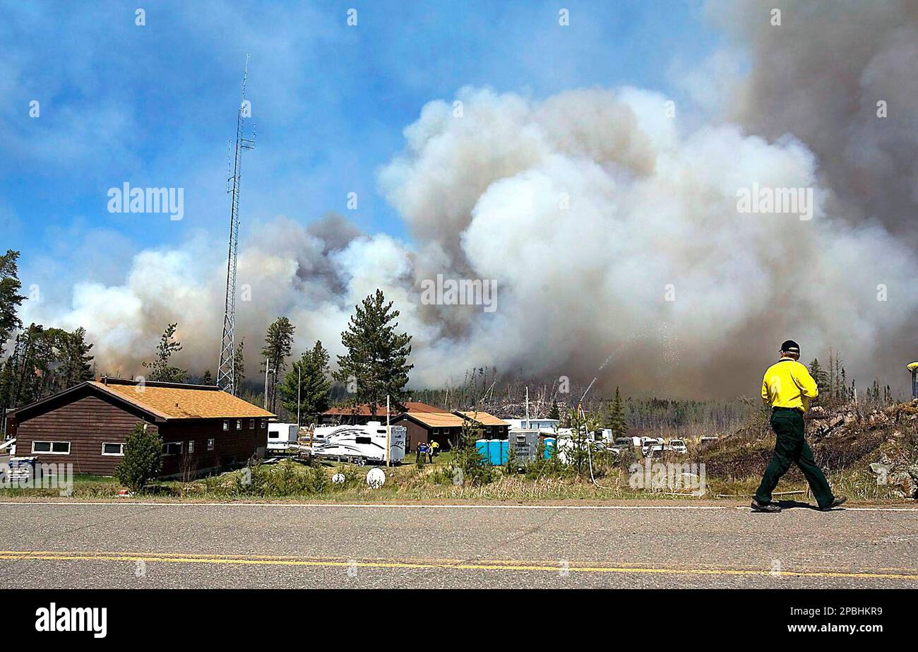 A wild land firefighter looks back at a portion of the Ham Lake Fire ...