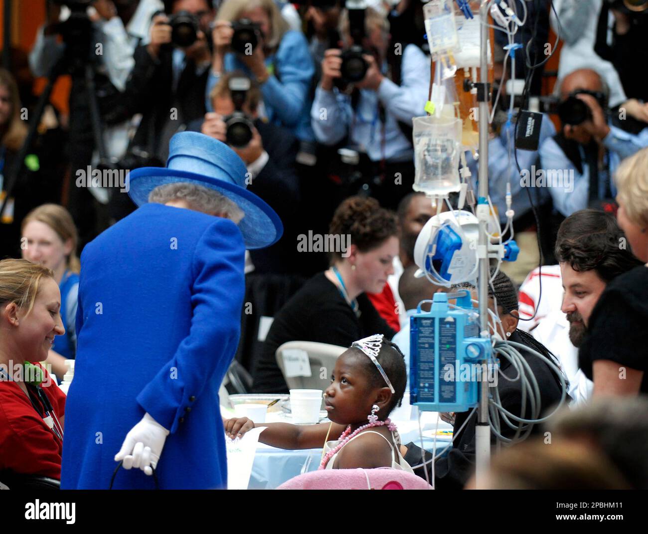 Porsha Rogers, center, 8, wears a tiara to greet Britain's Queen ...