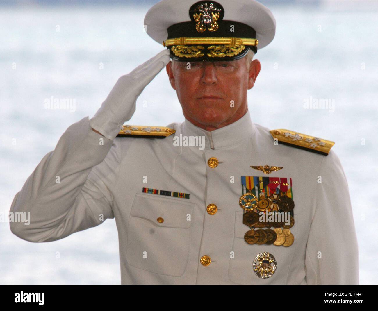 Adm. Robert F. Willard salutes as he assumes command of the U.S ...