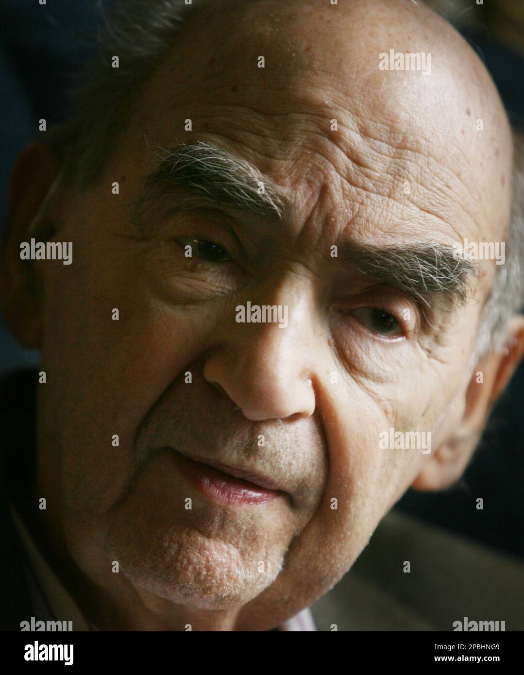 Larry Orbach, a Holocaust survivor, speaks in the living room of his ...