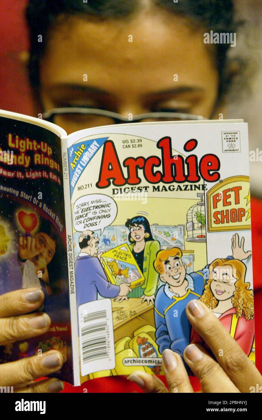 An enthusiast reads an Archie comic at Oxford Book Shop in Calcutta ...