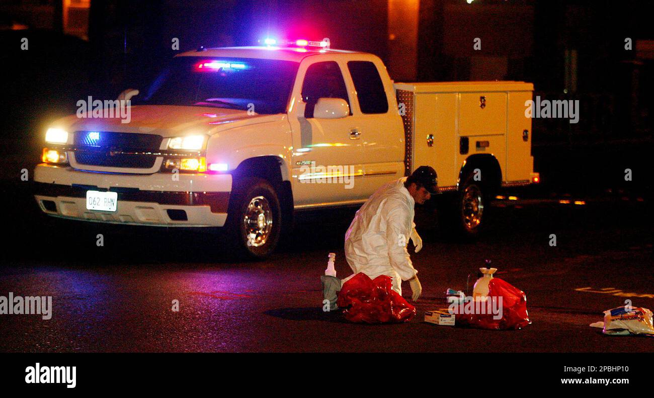 A man cleans up the crash scene where boxer Diego "Chico" Corrales was ...