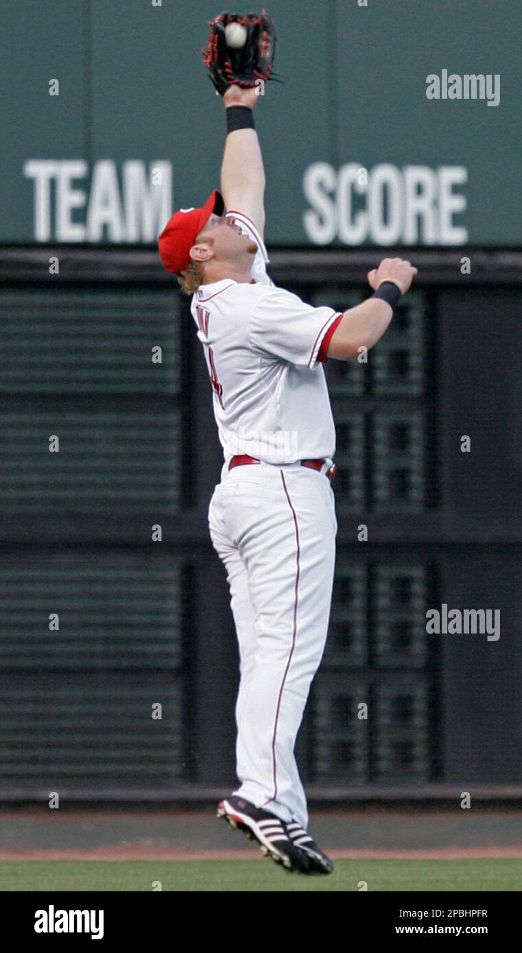 Cincinnati Reds left fielder Adam Dunn catches a fly ball hit by ...