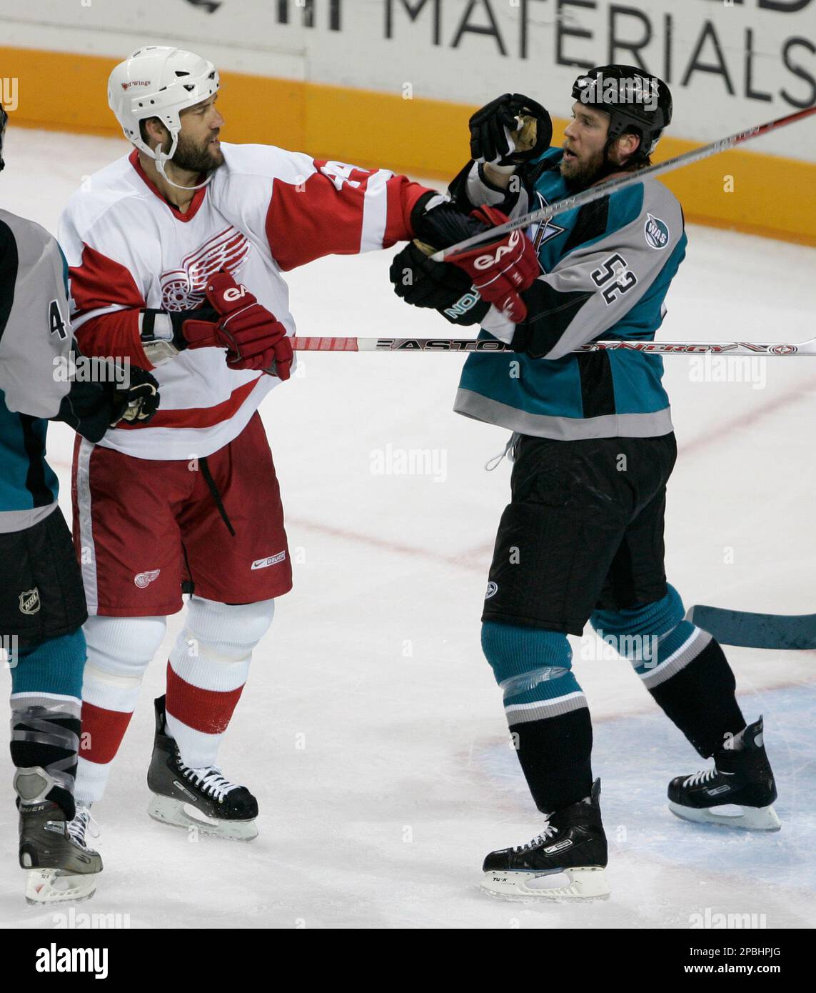 San Jose Sharks defenseman Craig Rivet (52) and Detroit Red Wings right ...