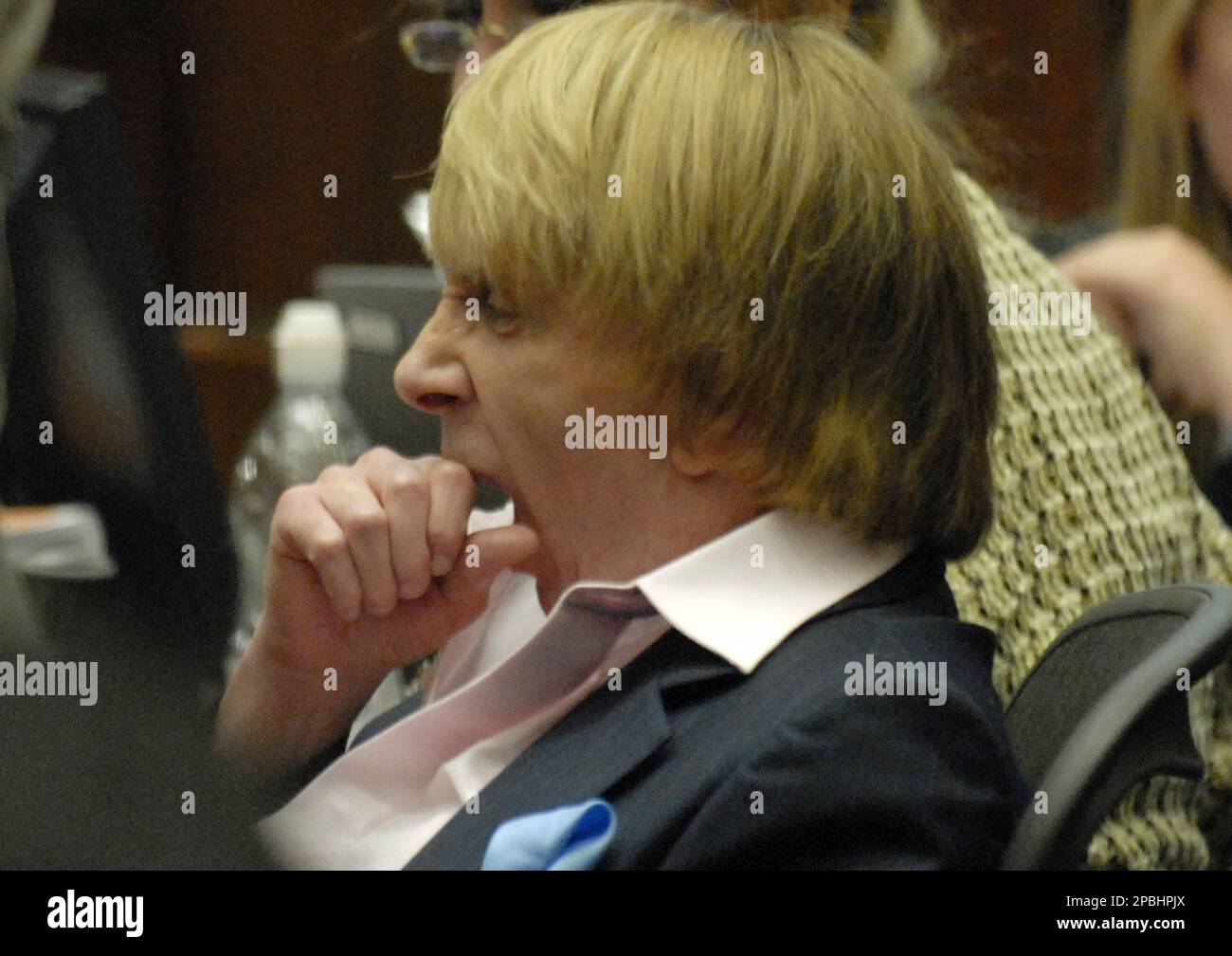 Music producer Phil Spector yawns at the end of a full day during his ...