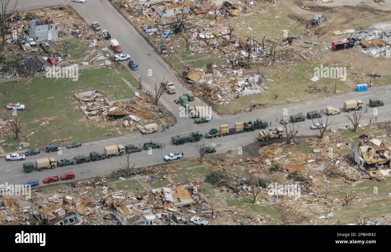 Kansas National Guard stages along a street in Greensburg, Kan., Monday ...