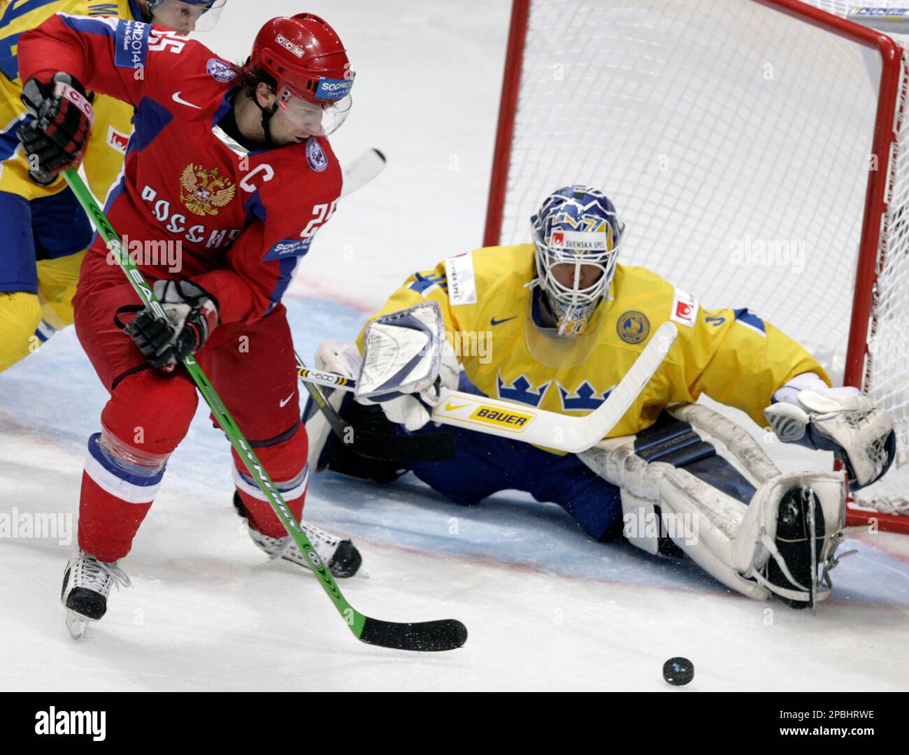 Russia's Alexey Morozov, left, attempts to score against Sweden's ...