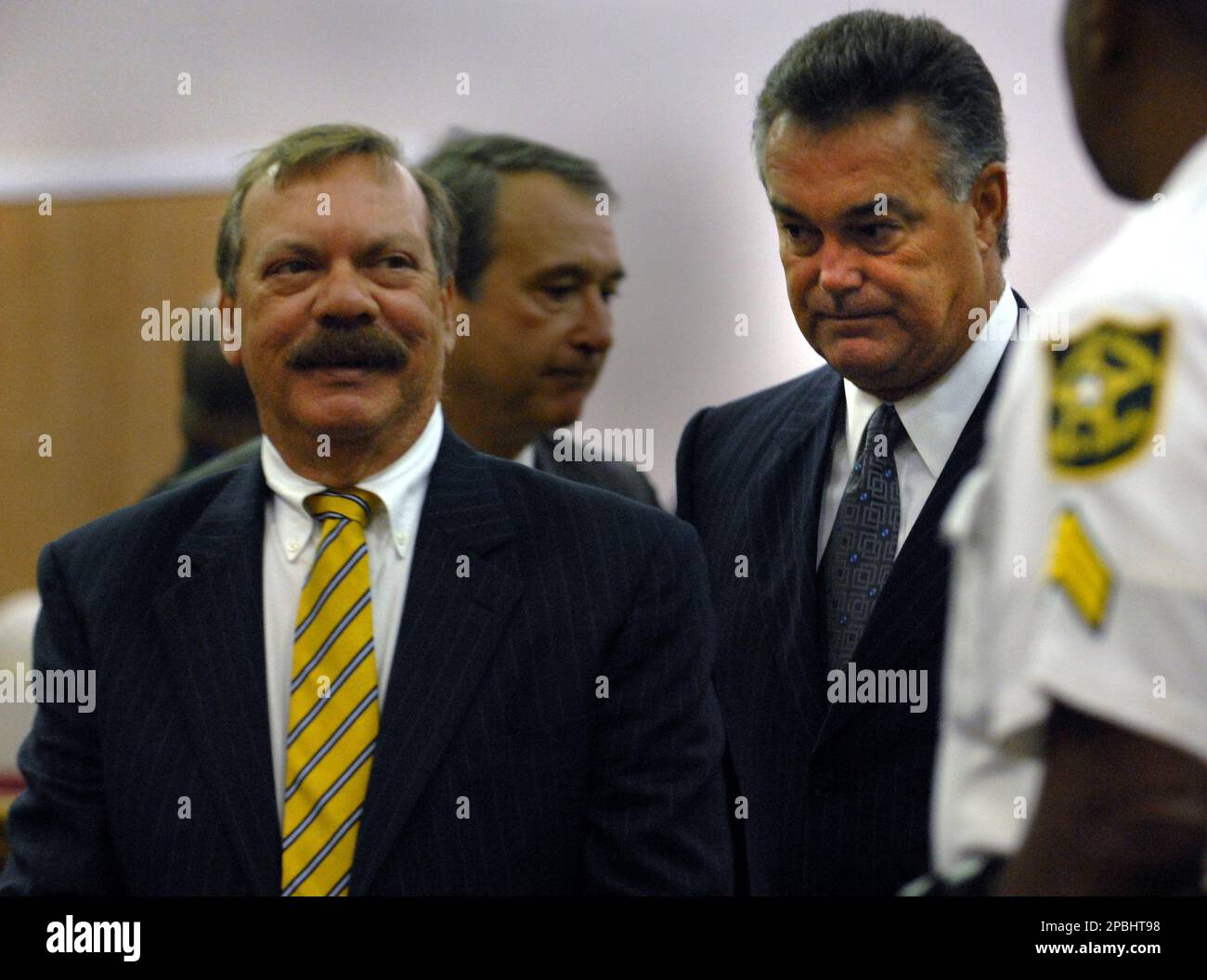Judge Lawrence Korda, left, leaves North Satellite Courthouse after a ...