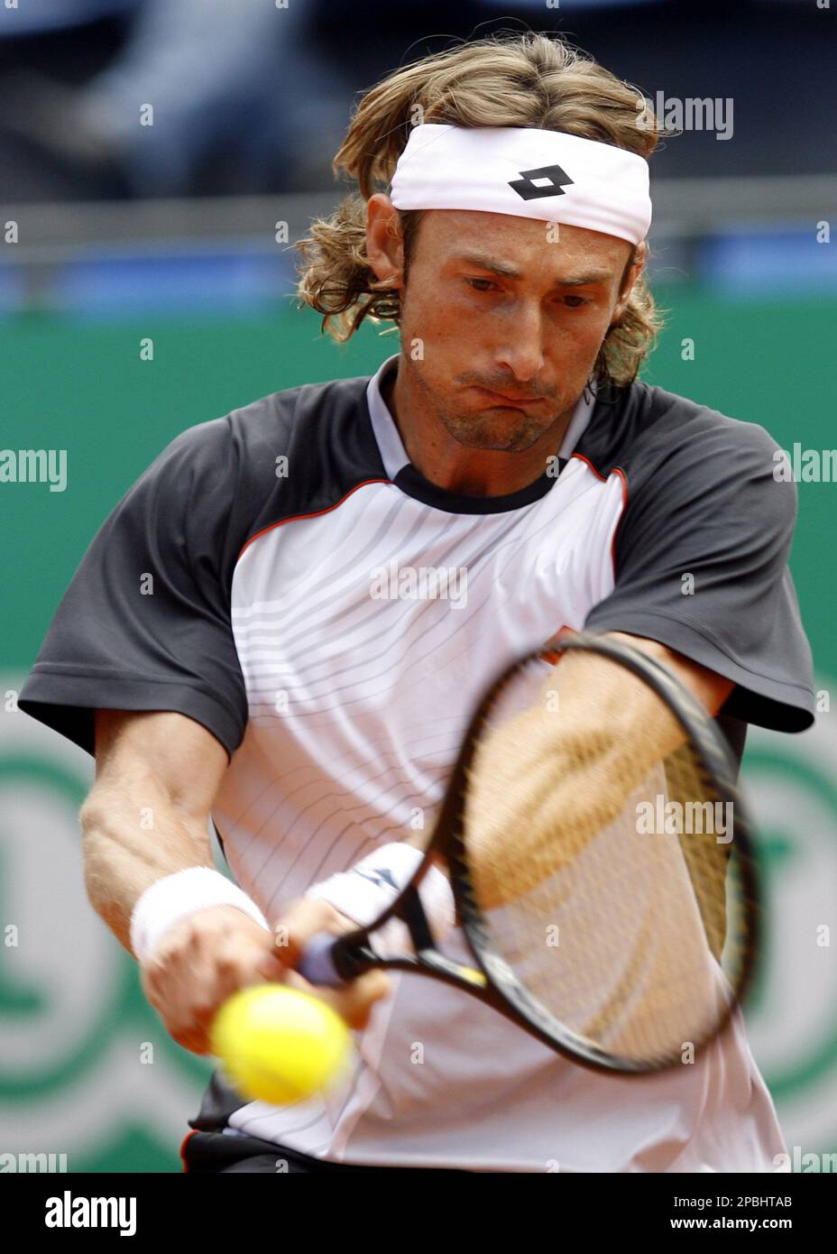 Juan Carlos Ferrero of Spain in action against Dominik Hrbaty of Slovak ...