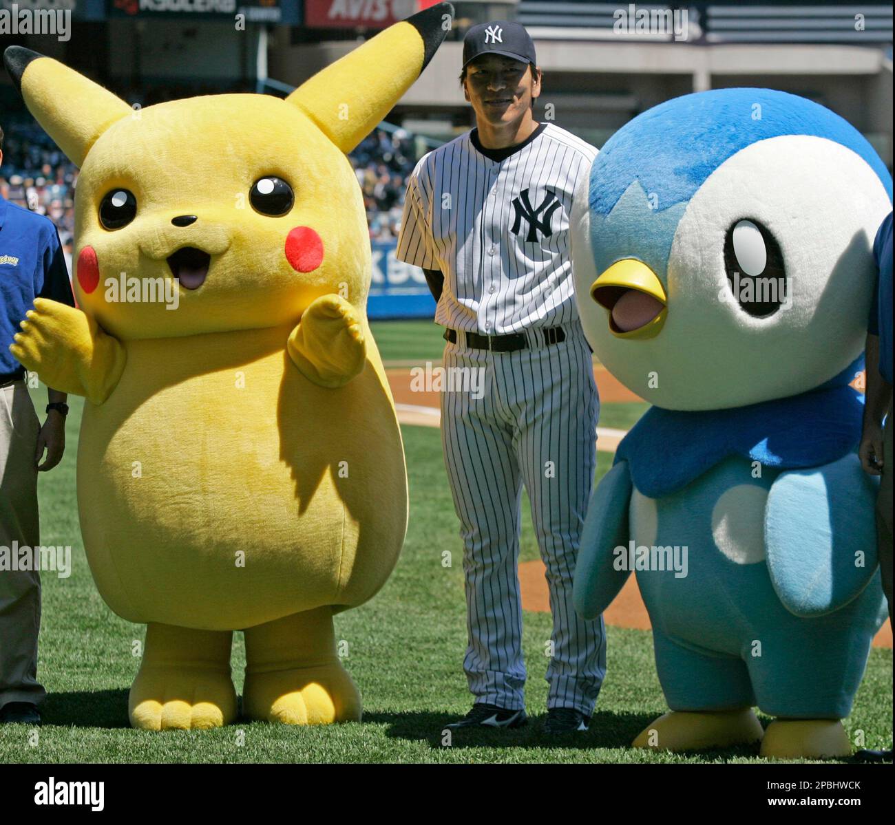 New York Yankees' Hideki Matsui, center, poses with Pokemon characters ...