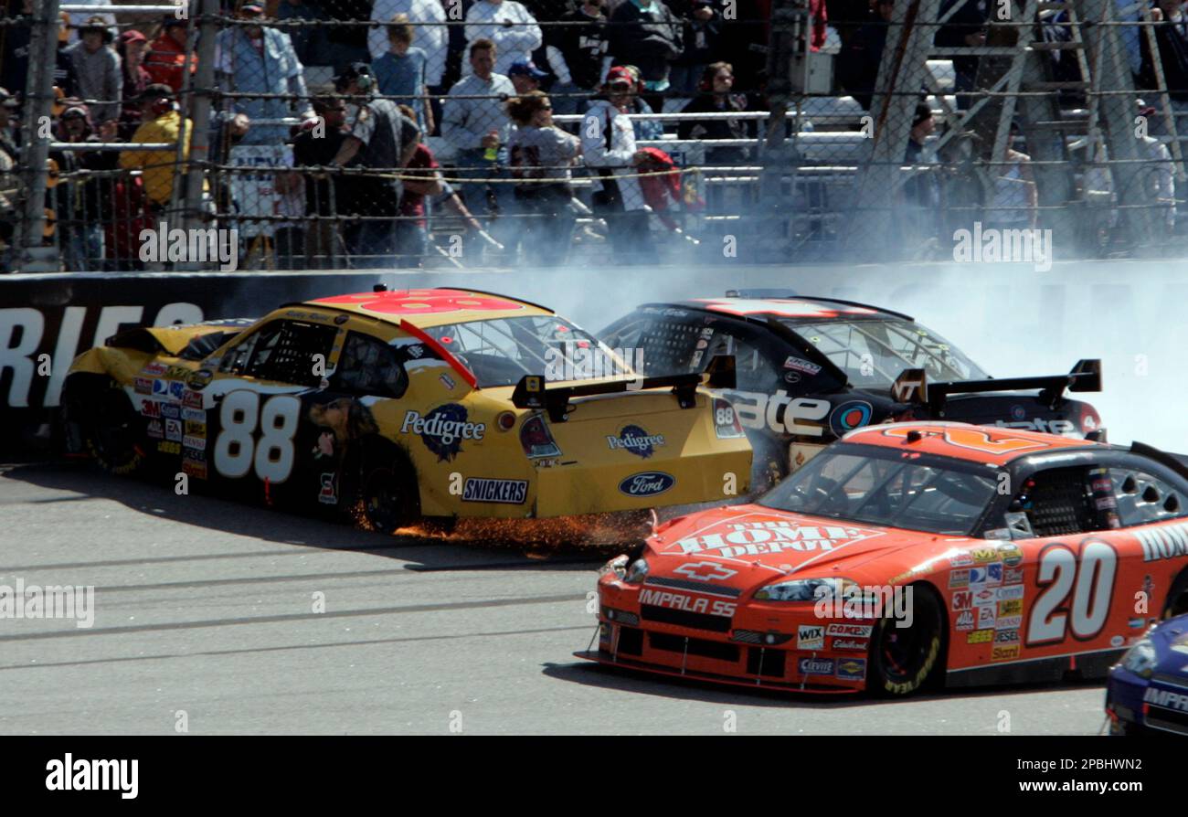 Ricky Rudd (88) hits the wall along with Ward Burton (4) as Tony ...