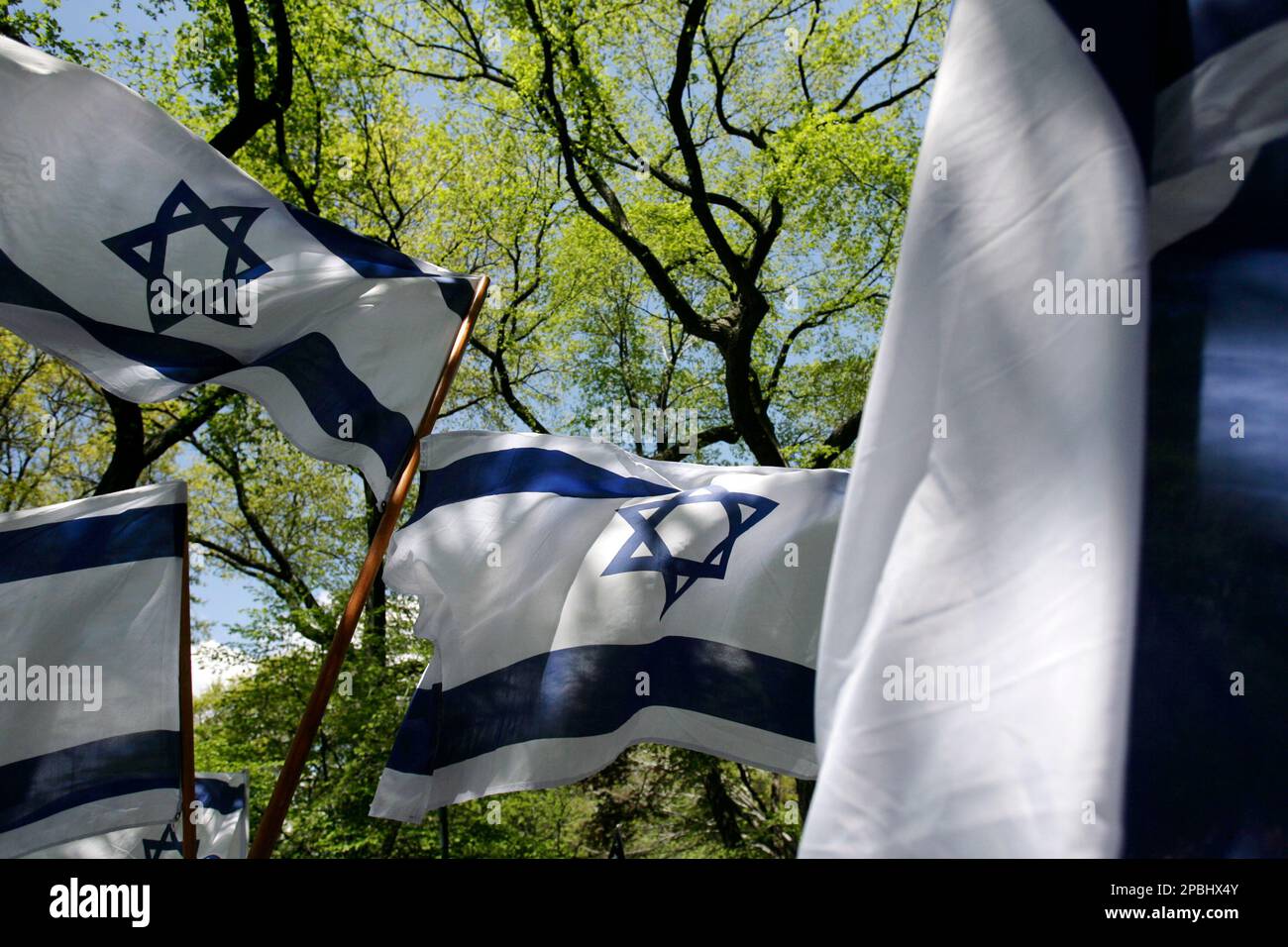 Israeli flags fill the air during the Salute to Israel Day Parade in ...