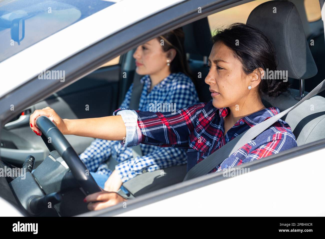 Latin American woman driving car Stock Photo - Alamy