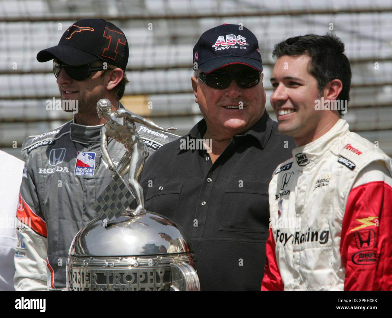 Four-time Indy 500 champion A.J. Foyt, center, poses for a photo with ...