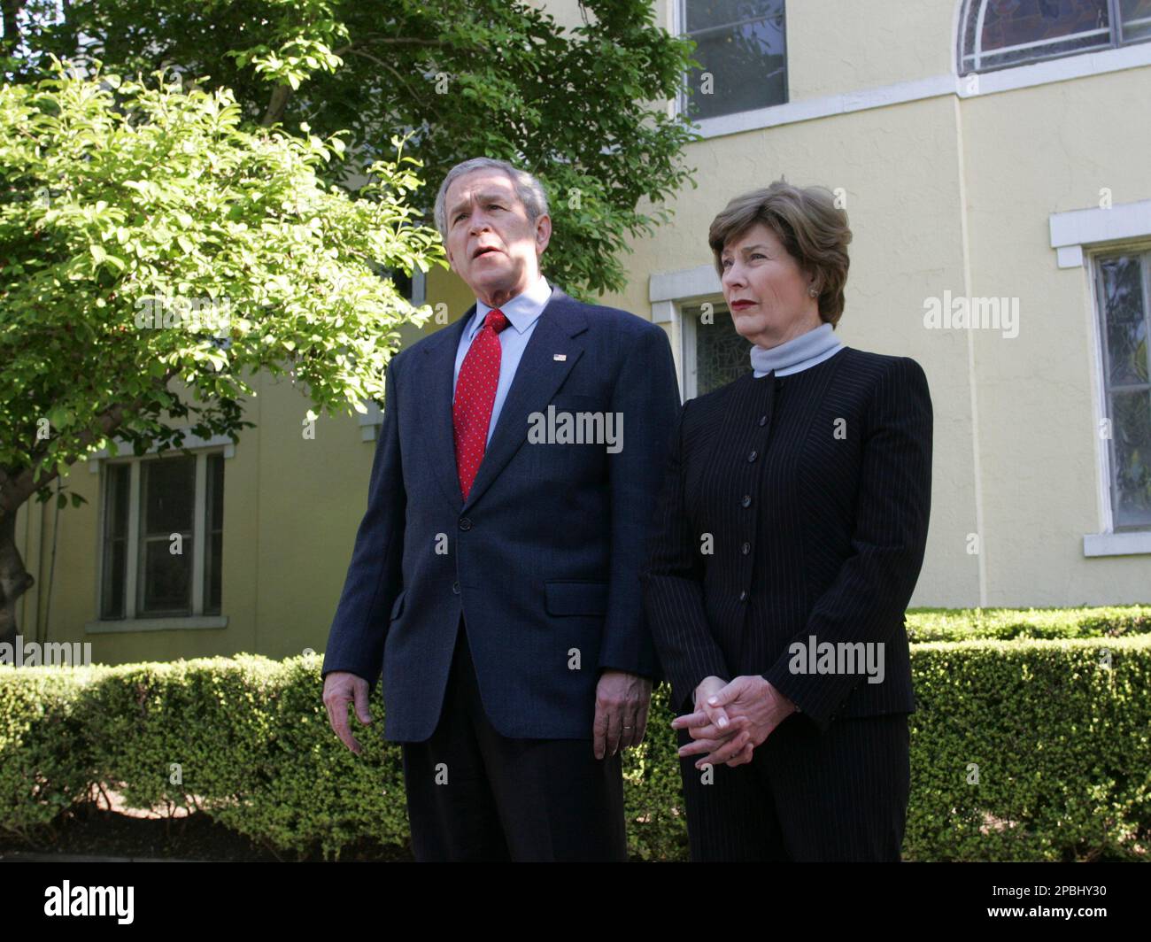 President Bush, accompanied by first lady Laura Bush, makes a statement ...
