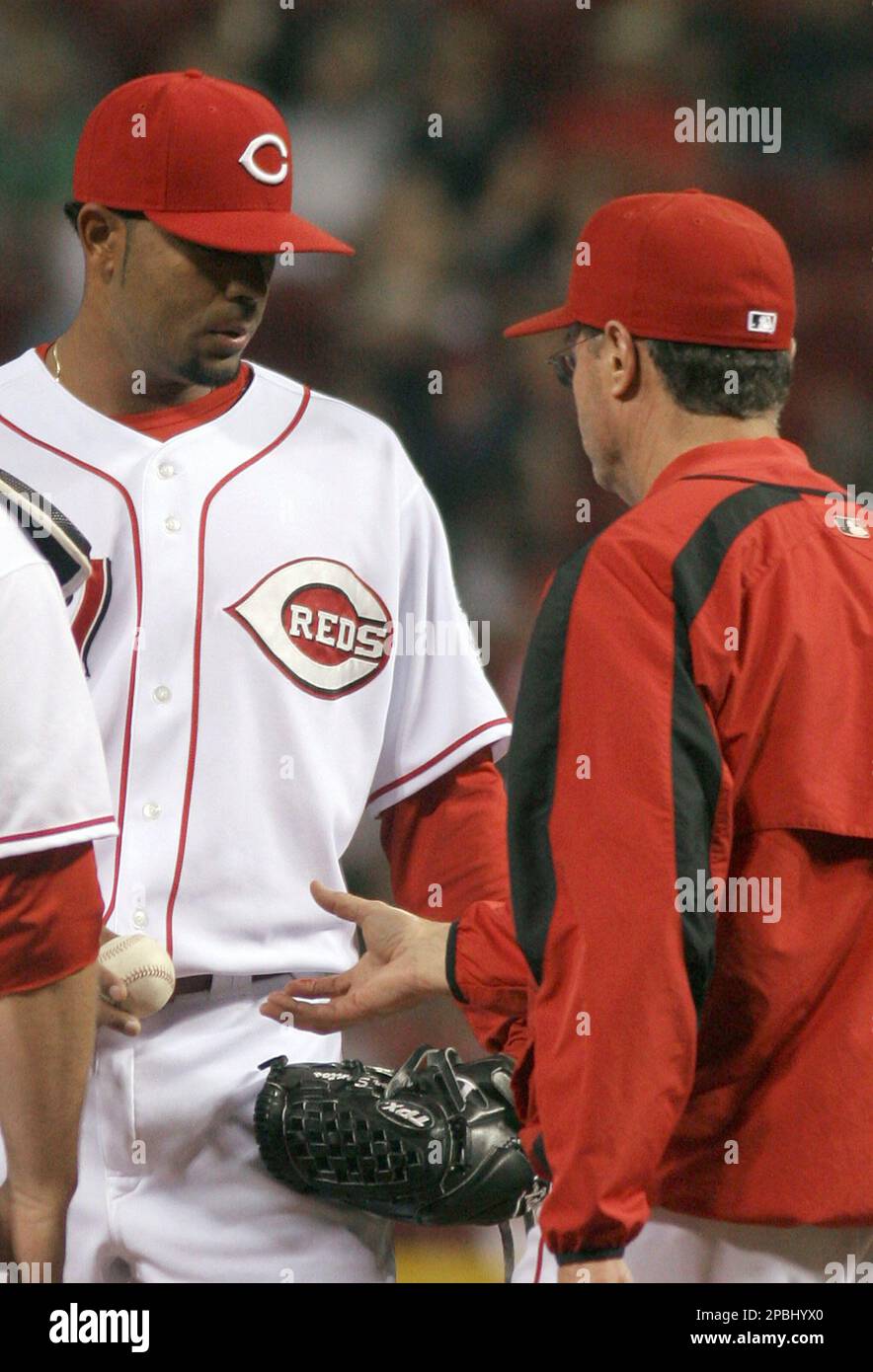 Cincinnati Reds manager Jerry Narron, right, takes the ball from ...