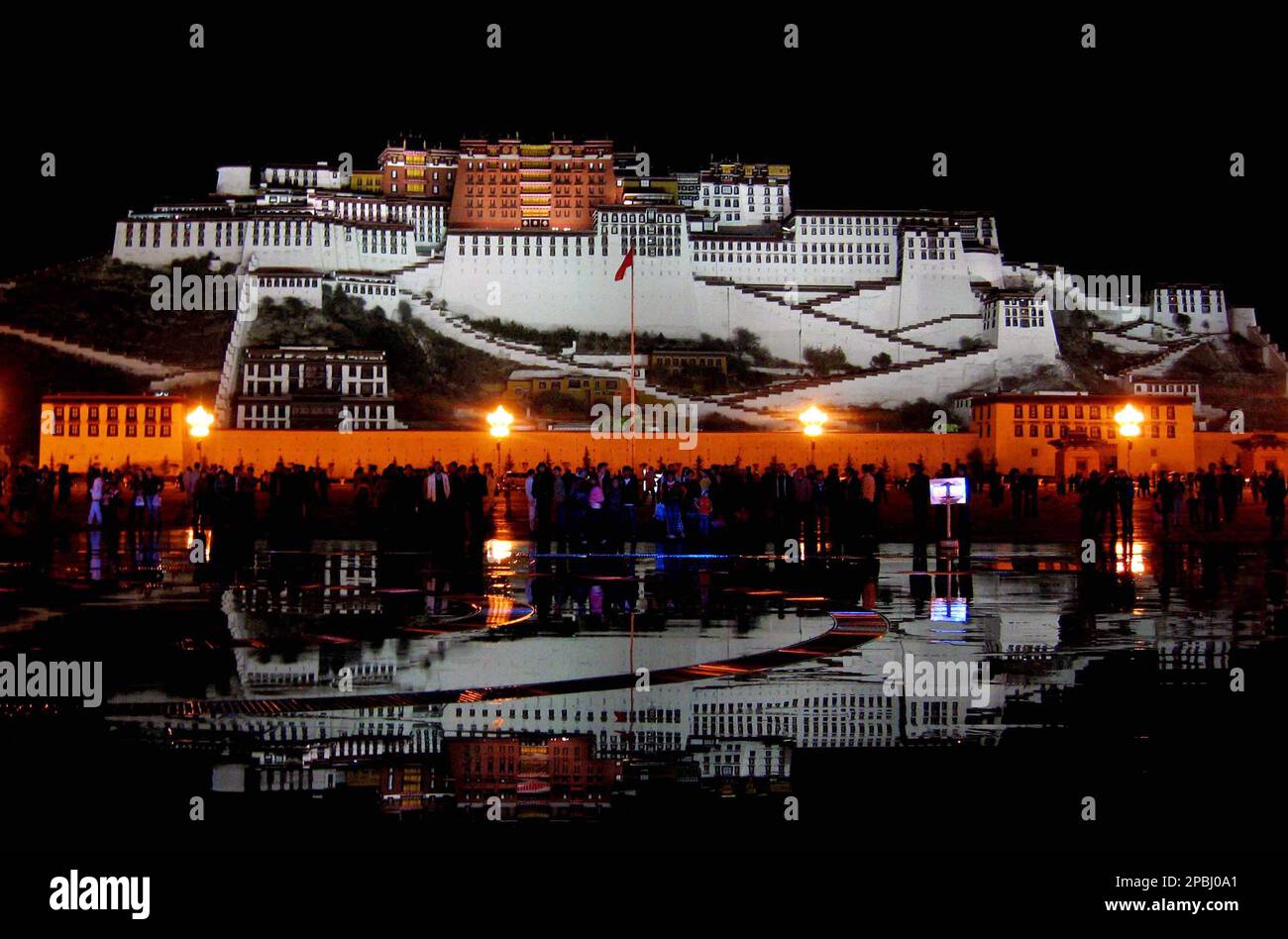 In this photo released by China's official Xinhua news agency, lights ...