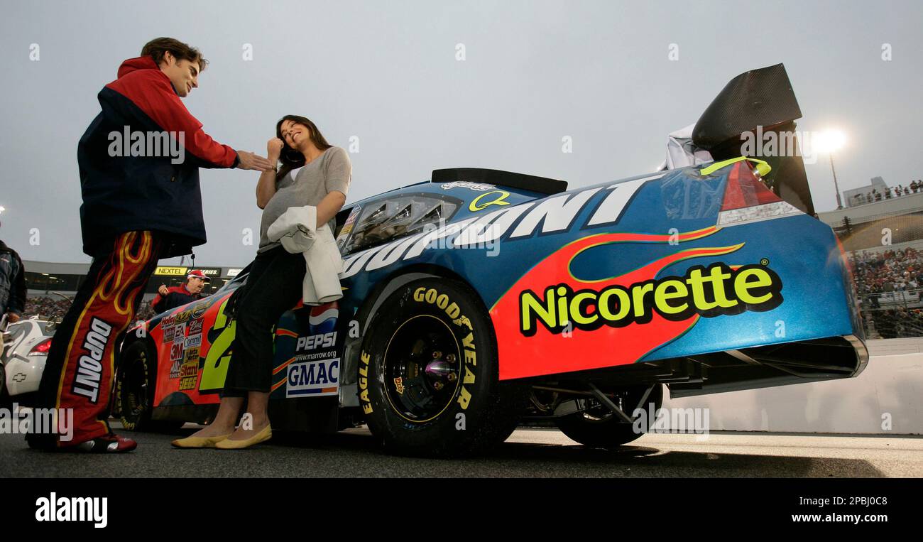 Jeff Gordon talks to his wife, Ingrid, before the NASCAR Nextel Cup ...