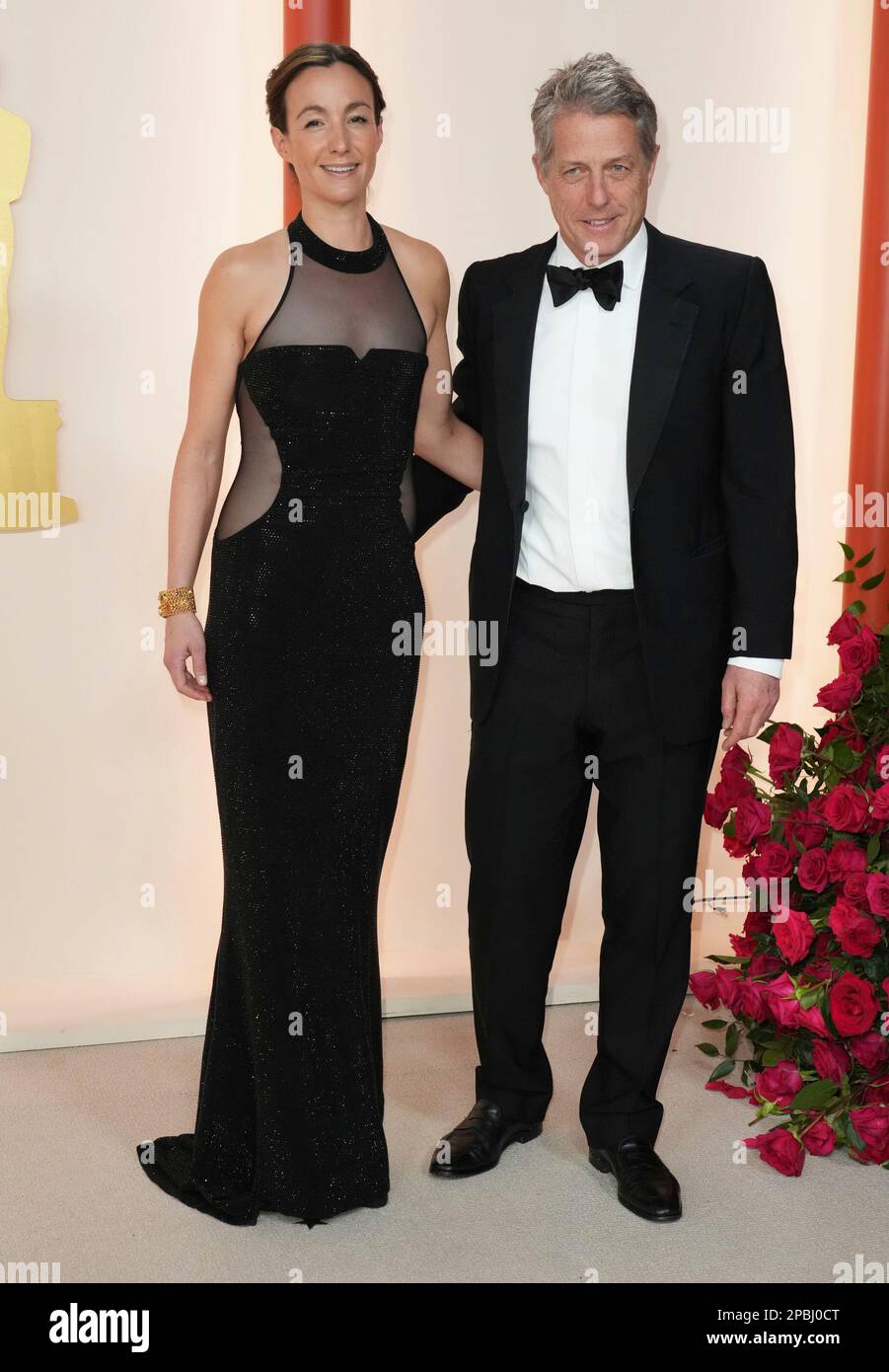 Anna Elisabet Eberstein, left, and Hugh Grant arrive at the Oscars on ...