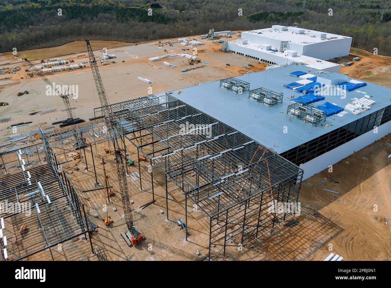 Crawler cranes are used for construction of metal steel framing beams ...