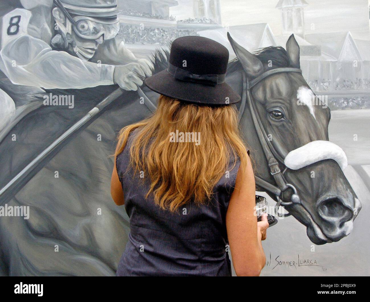 Susan Sommer-Luarca works on a painting of the 2007 Kentucky Derby ...