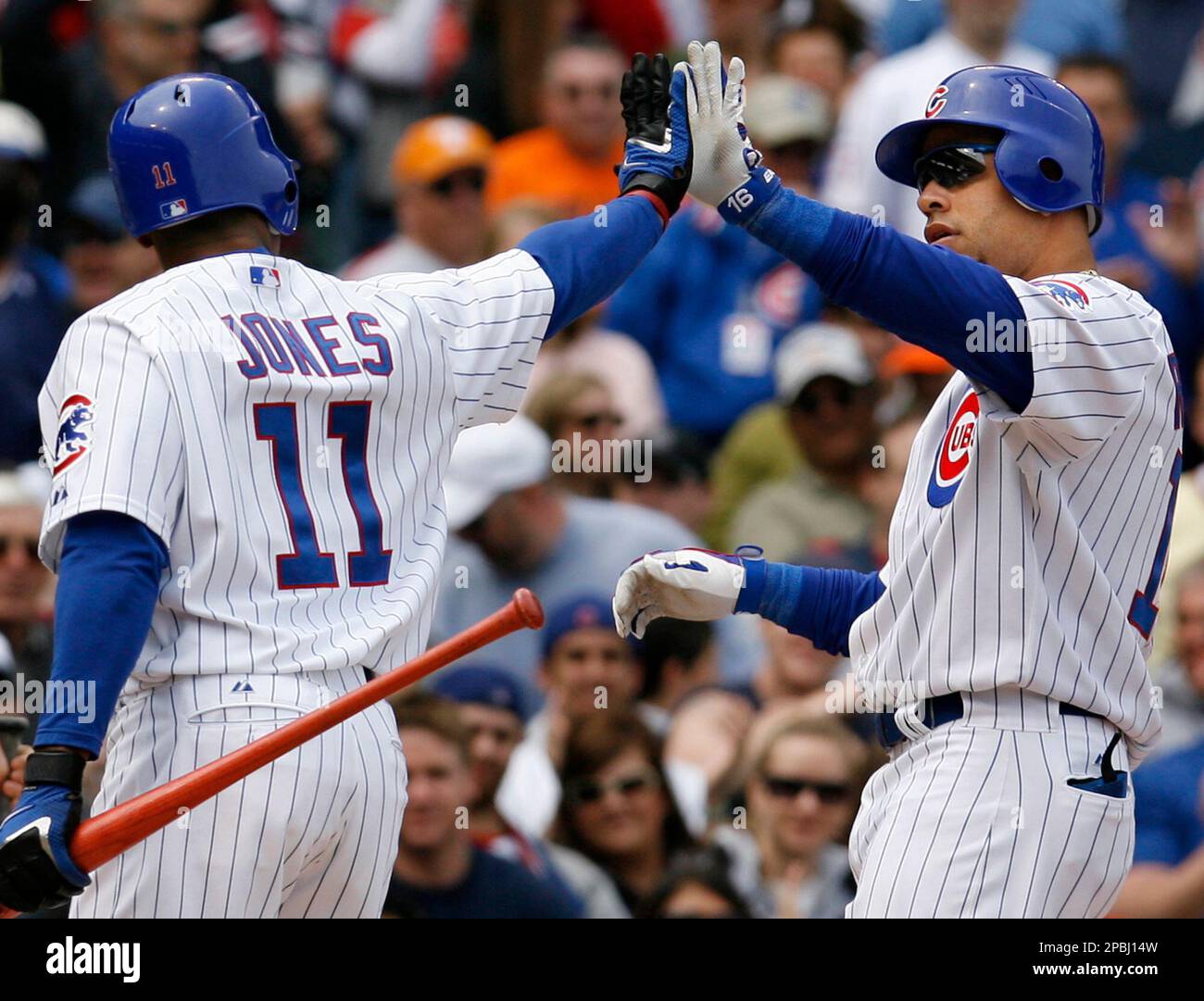 Chicago Cubs' Aramis Ramirez, right, celebrates with Jacque Jones after ...