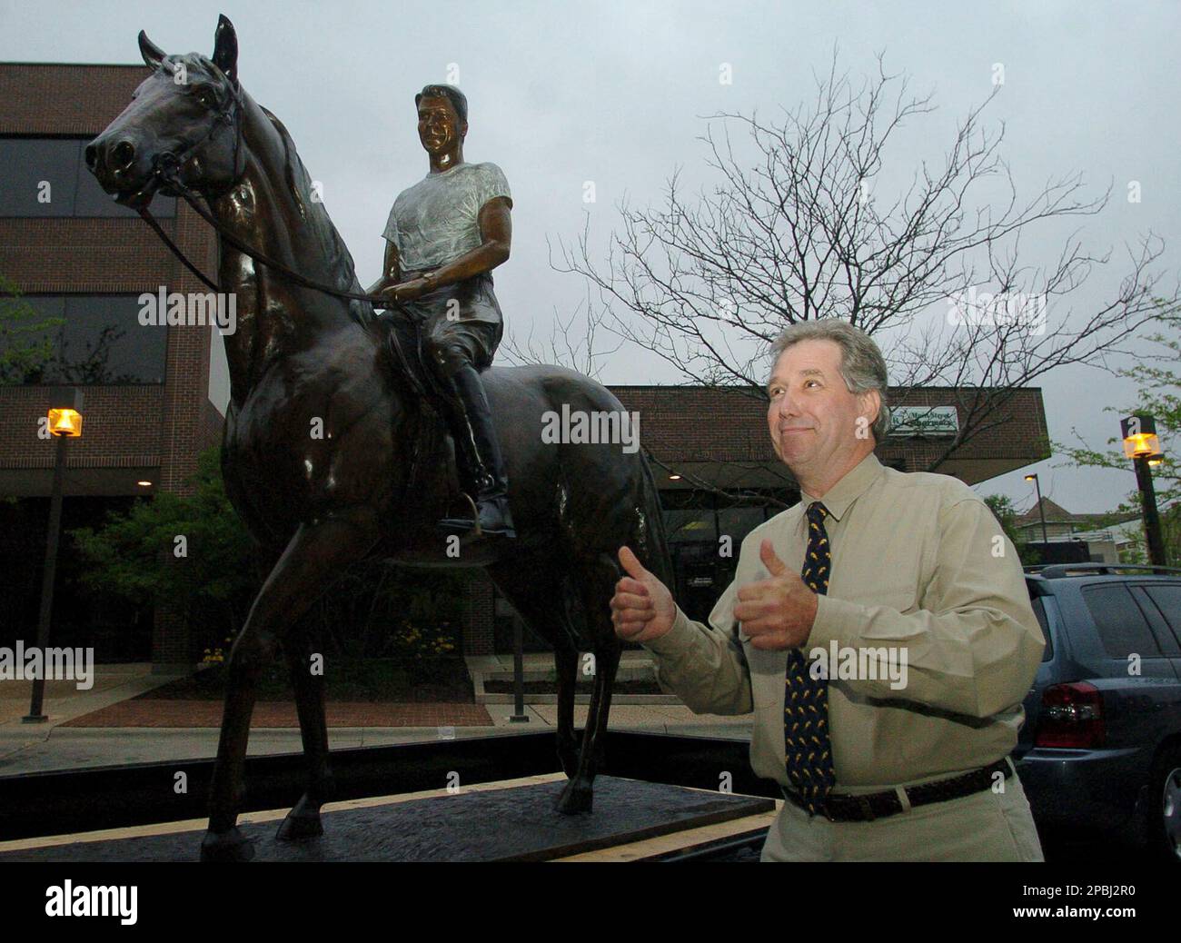 Sculptor Donald Reed stands with his life size statue of former ...