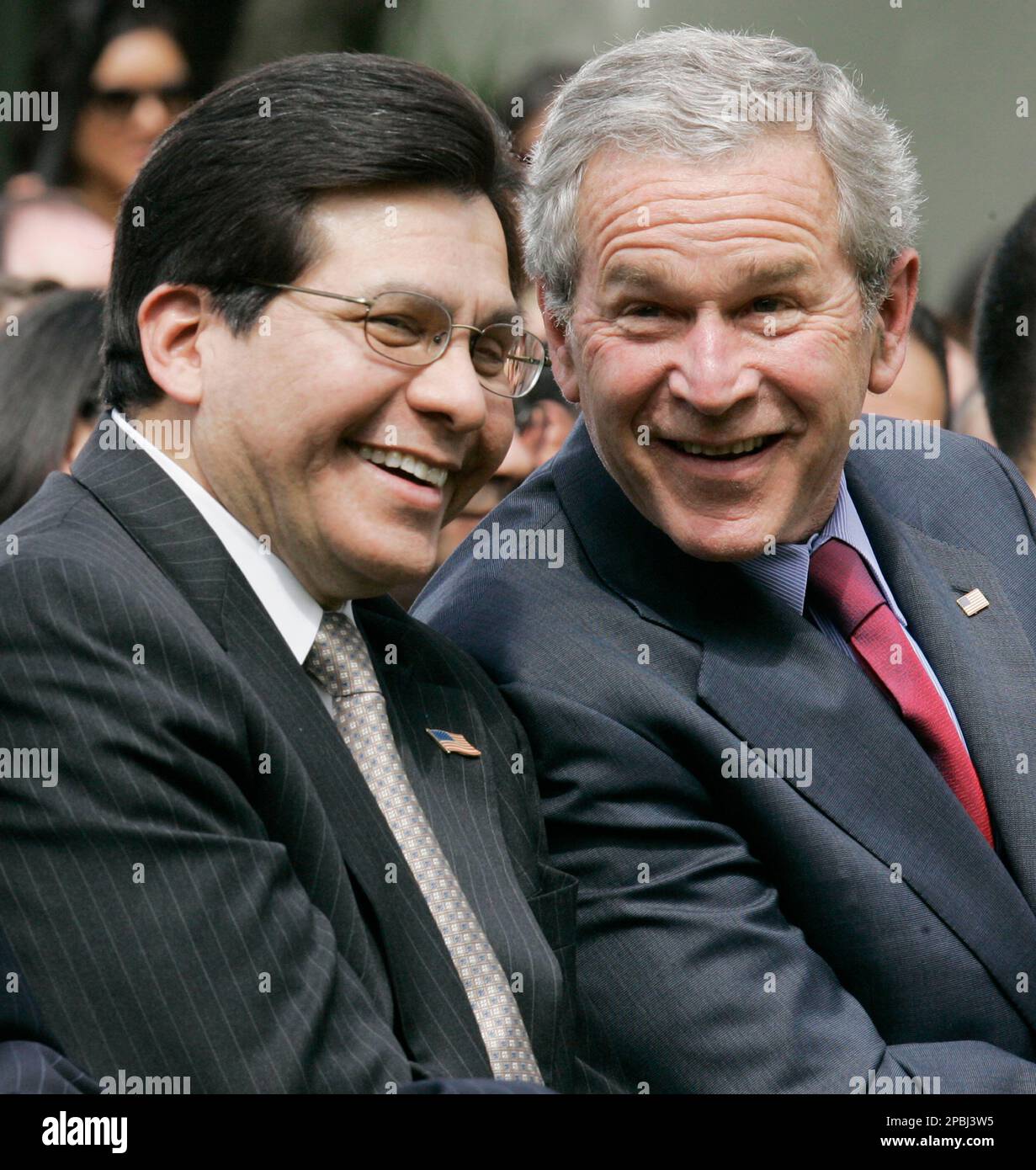 President Bush, right, and Attorney General Alberto Gonzales, attend a ...