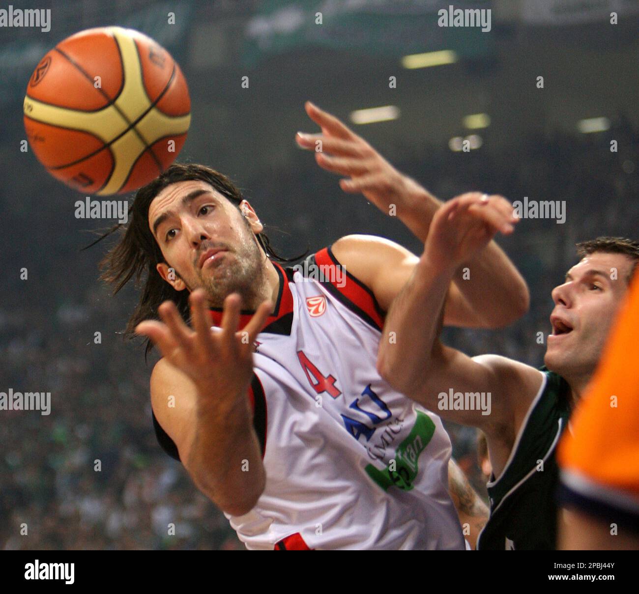 Sani Becirovic of Panathinaikos, right, tries to stop Luis Scola of Tau ...